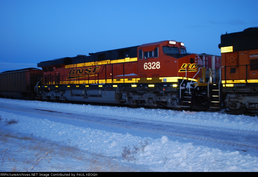BNSF 6328 really shows her new reflective BNSF paint logo with this early am shot.